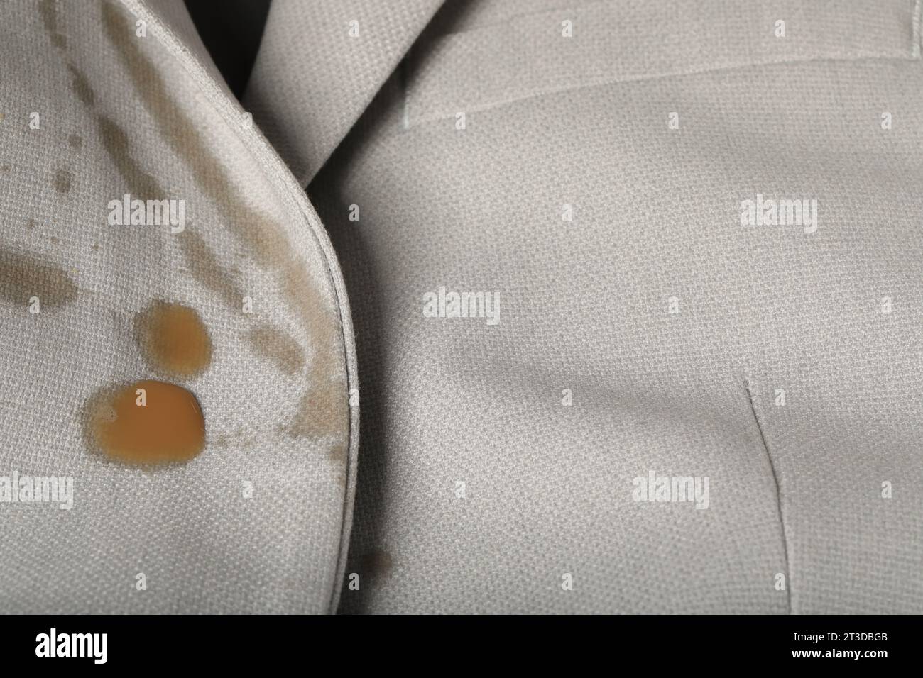 Dirty jacket with stain of coffee as background, closeup Stock Photo ...