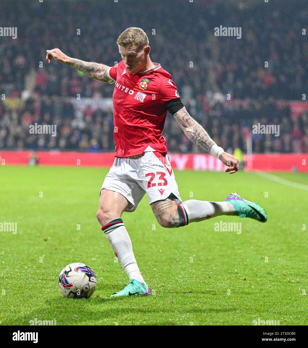 James McClean 23# of Wrexham Association Football Club crosses the ball ...