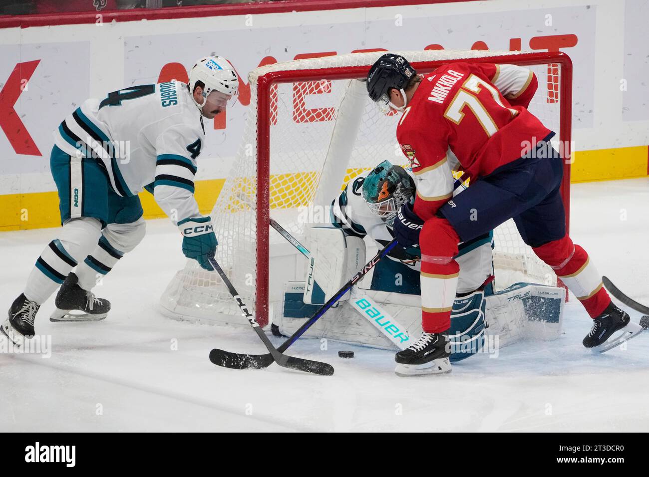San Jose Sharks defenseman Kyle Burroughs (4) and goaltender Mackenzie ...