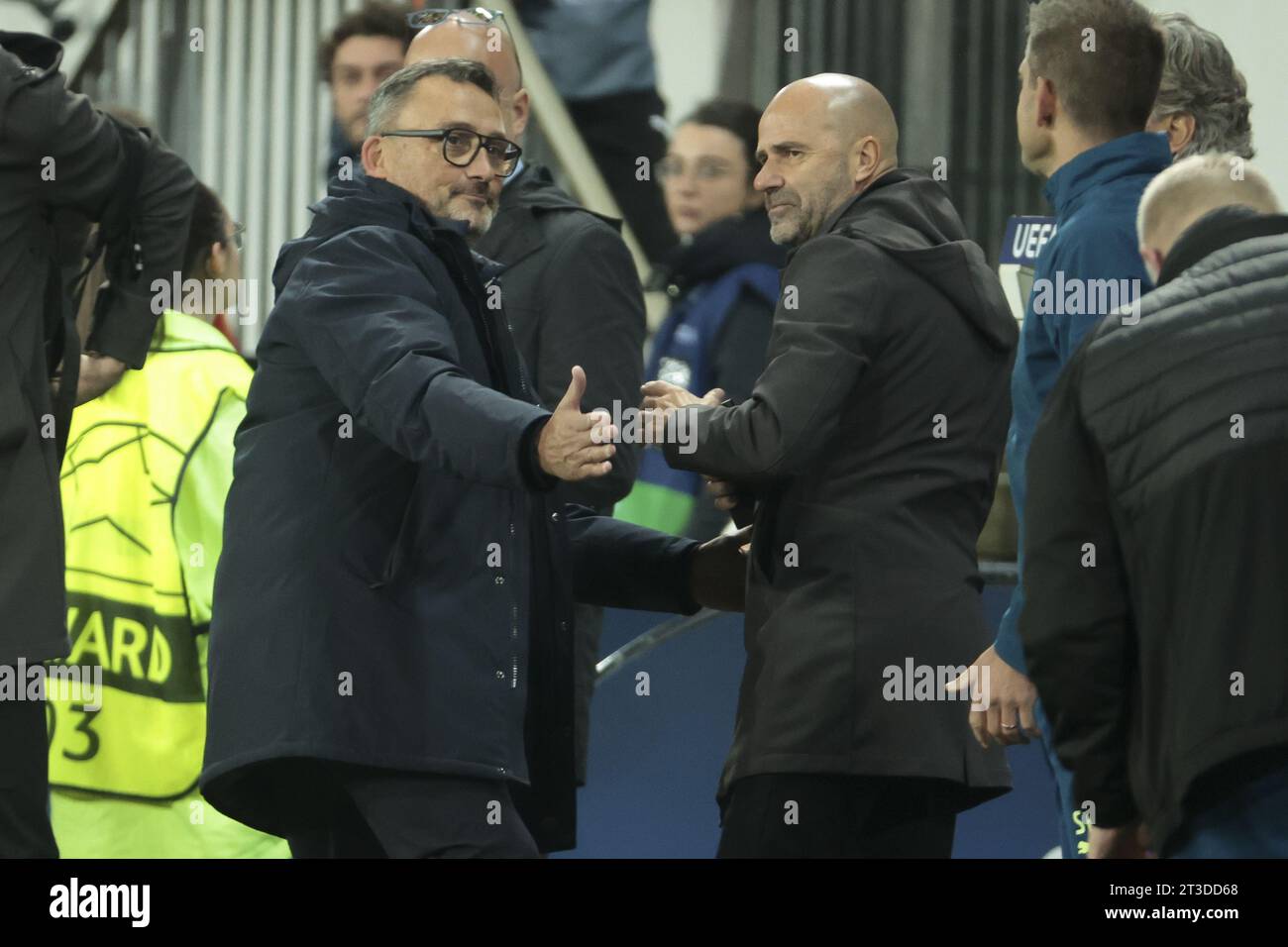 Coach of RC Lens Franck Haise salutes Coach of PSV Eindhoven Peter Bosz ...