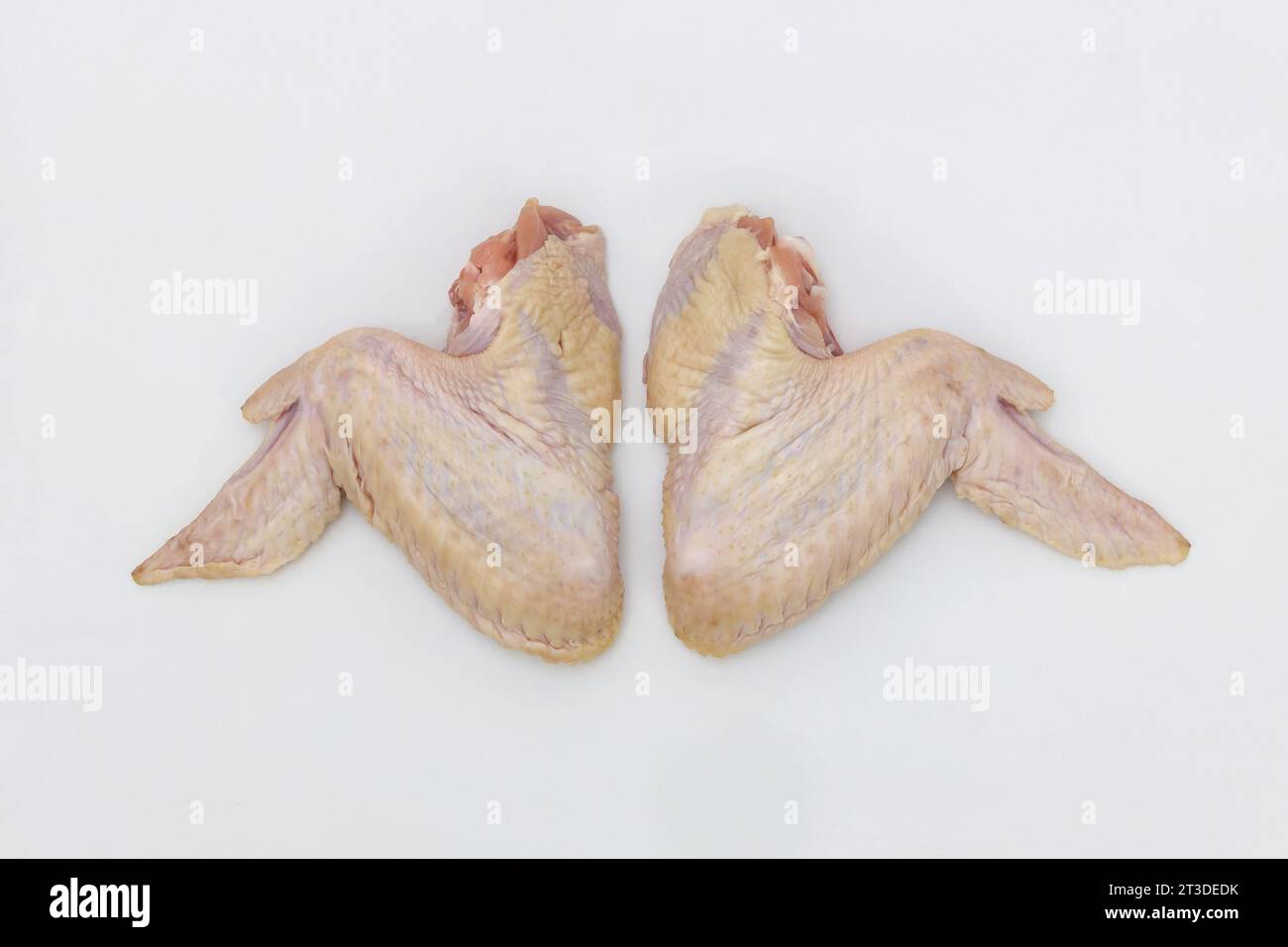 The raw wings of chicken are isolated on a white background Stock Photo ...