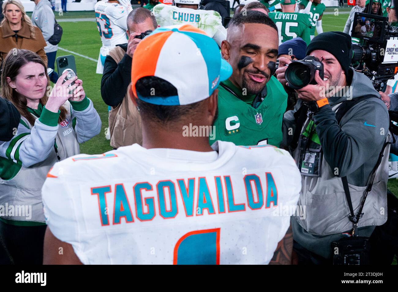 Philadelphia Eagles quarterback Jalen Hurts (1) talks with Miami Dolphins quarterback Tua ...
