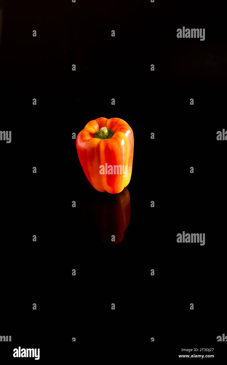 Pepper horizontal on black background Stock Photo - Alamy