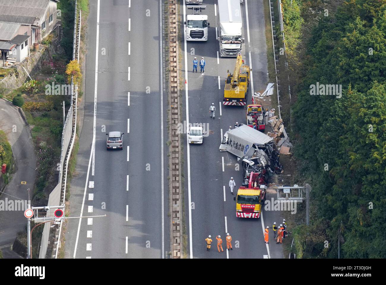 An aerial photo shows an accident involving three trucks and other ...