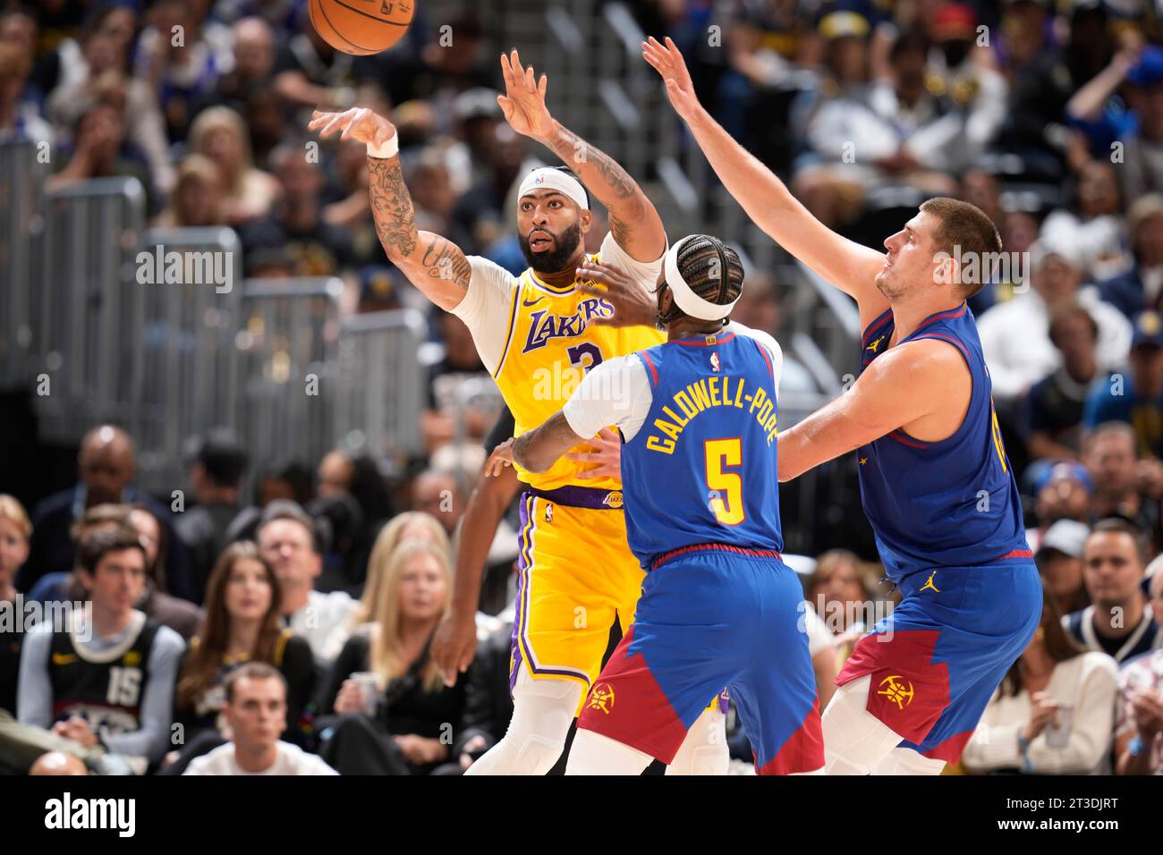 Los Angeles Lakers forward Anthony Davis, left, passes the ball as ...