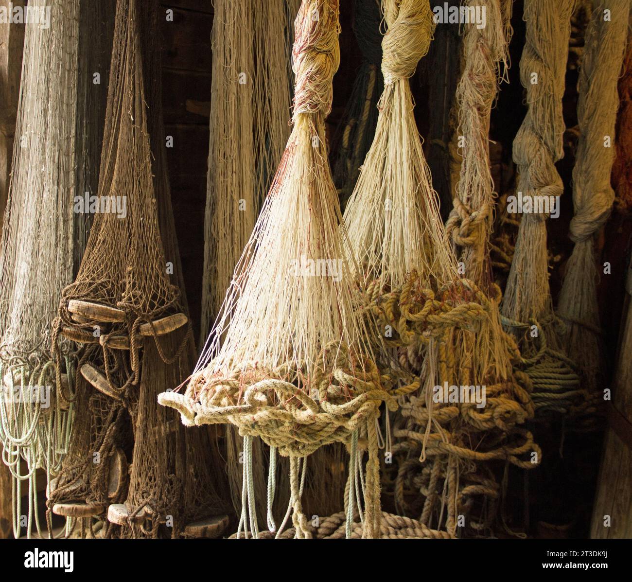 The old fishing nets hanging in a shed Stock Photo - Alamy