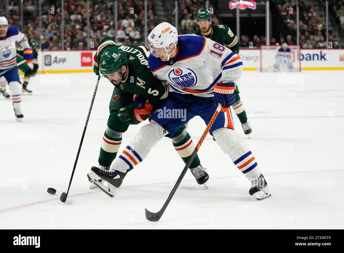 Minnesota Wild defenseman Jake Middleton, left, and Edmonton Oilers ...