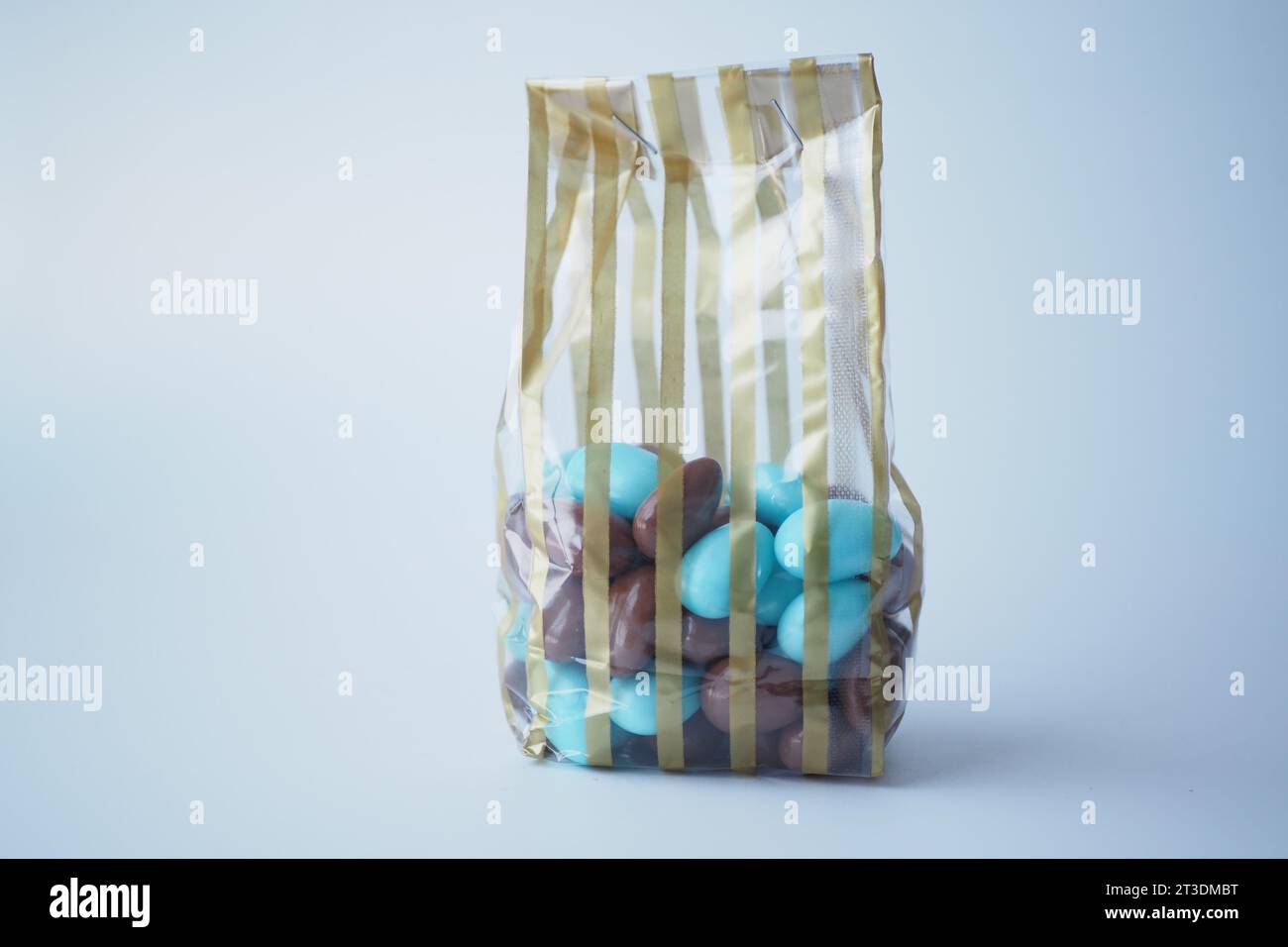 chocolates in a plastic packet on white background Stock Photo - Alamy