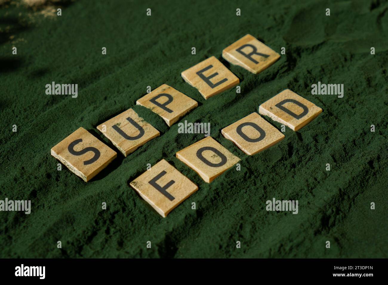 SUPERFOOD letter chlorella on green background of algae superfood ...