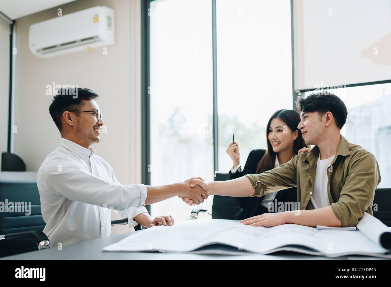 Engineers, designers and interior designers are handshake shack hands ...