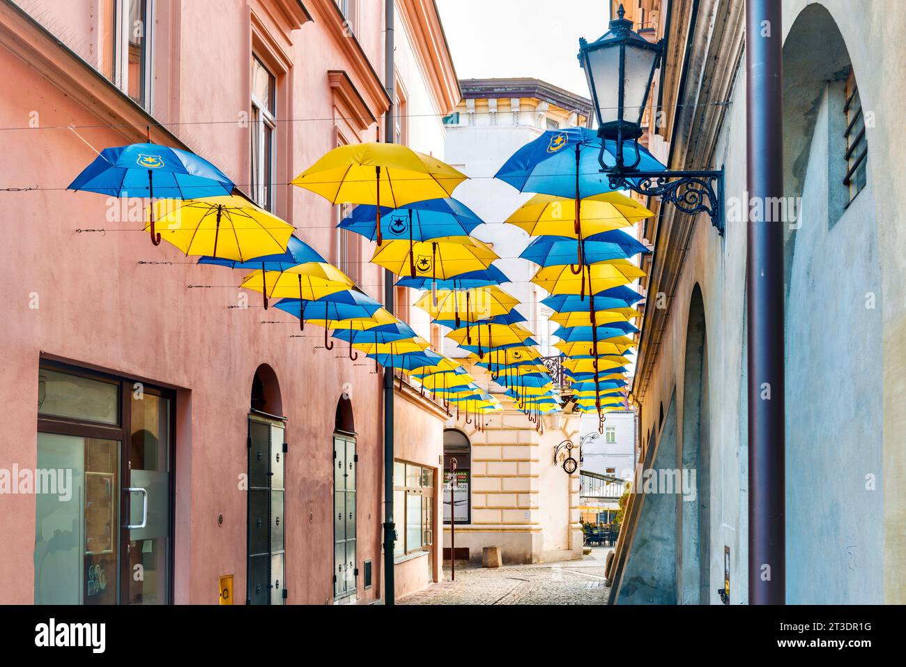 Multi-colored umbrellas over Piekarska Street near Tarnow Market Square ...