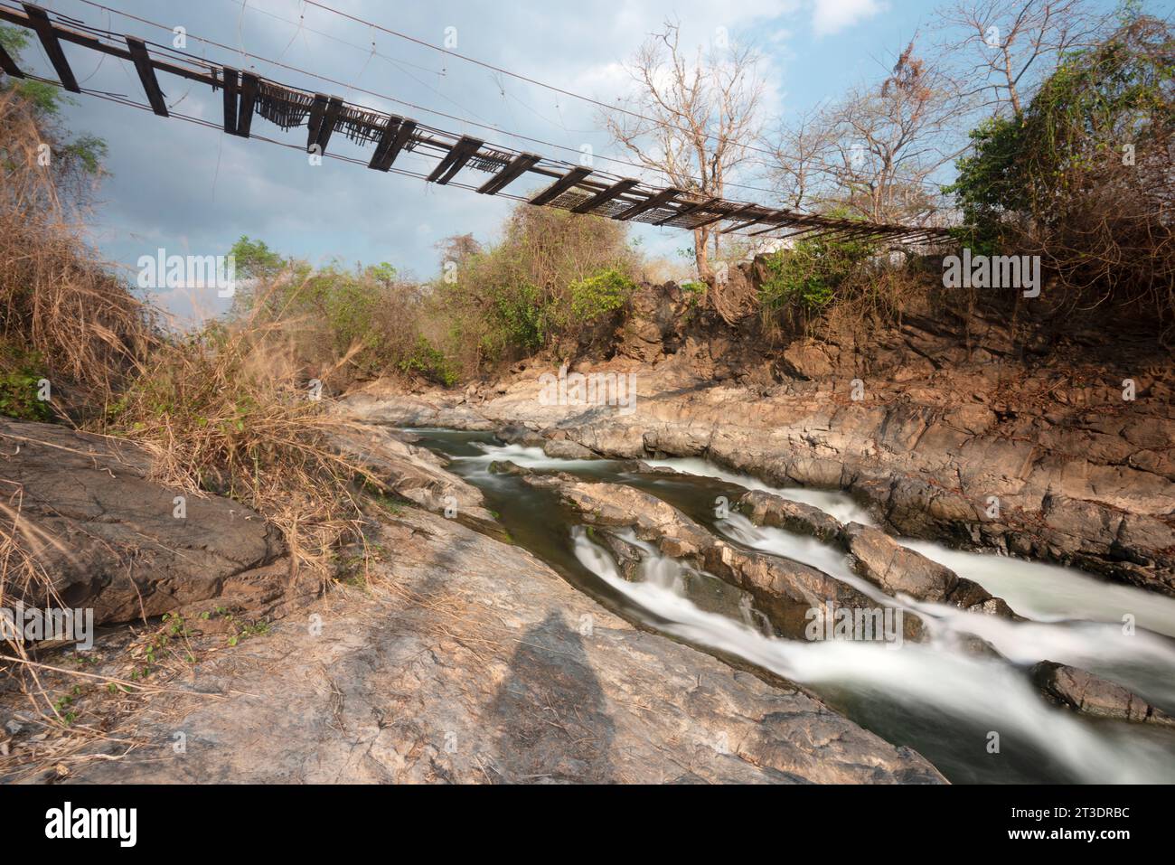 With a warning sign,old and In need of repair,much used by travelers ...