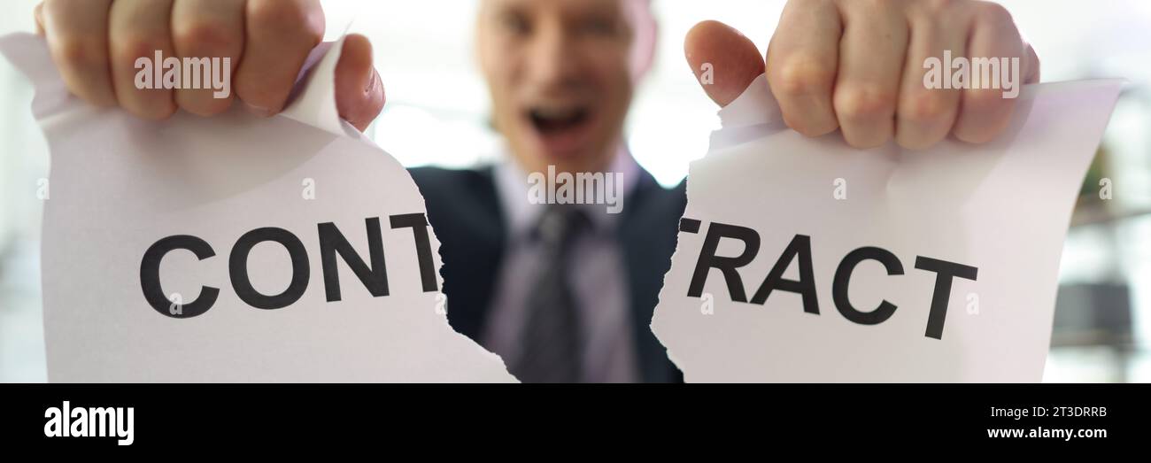 Man holds torn sheet of paper expressing dissatisfaction Stock Photo ...