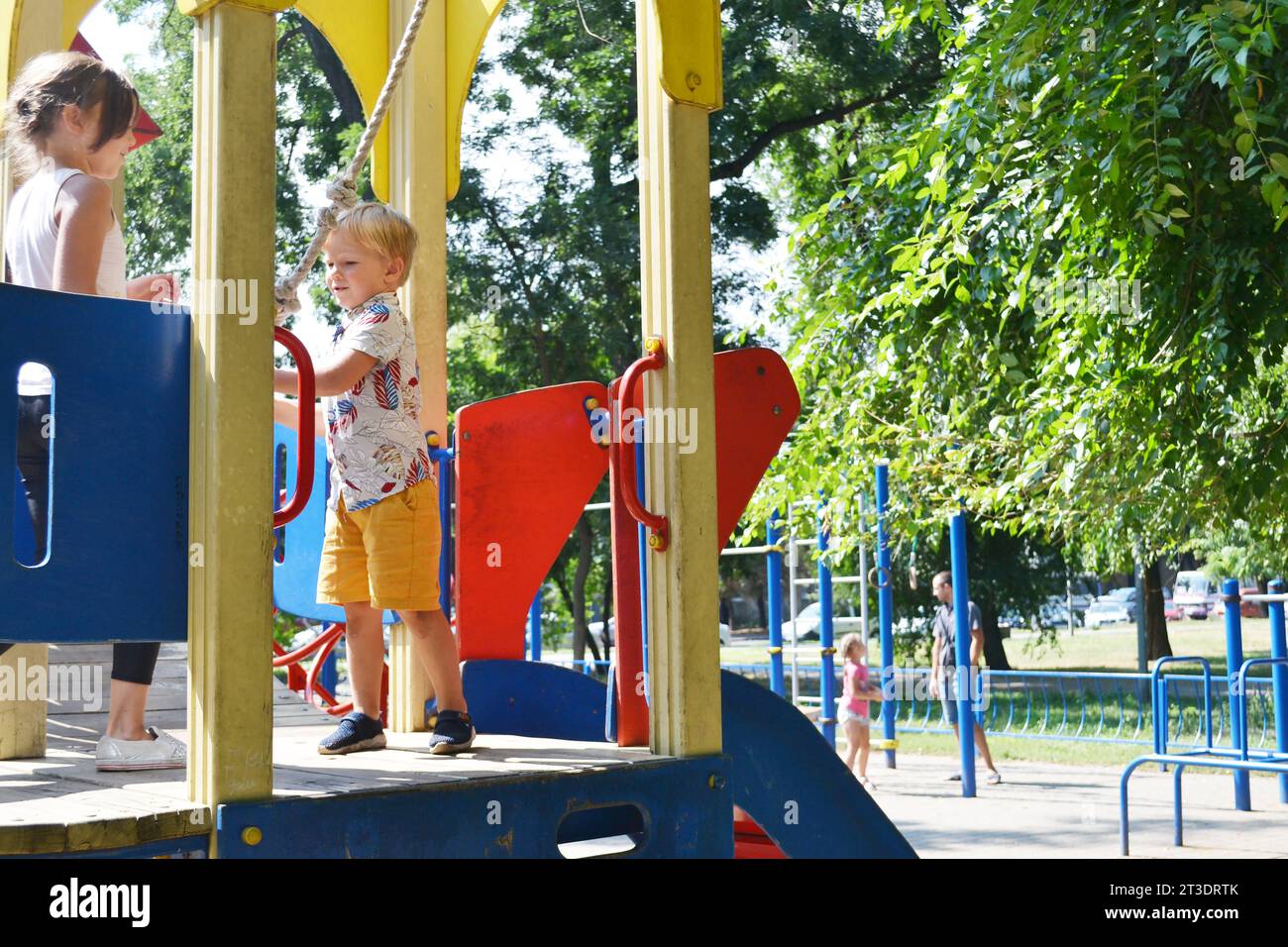 Little children run around and play in the playground. Game center for ...