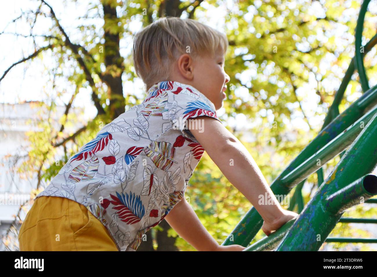 Little children run around and play in the playground. Game center for ...