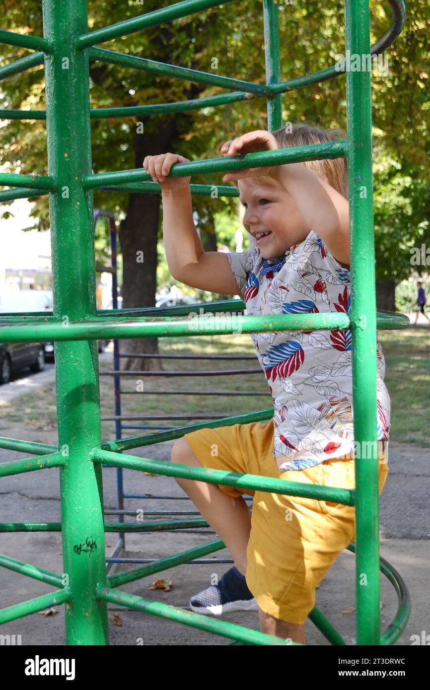 Little children run around and play in the playground. Game center for ...