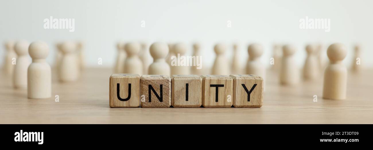Word Unity made of wooden cubes against white figures Stock Photo - Alamy