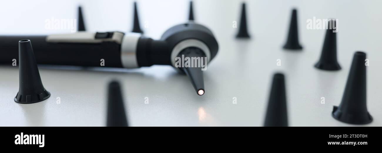 Modern otoscope with light on tip and caps for ear checkup Stock Photo ...