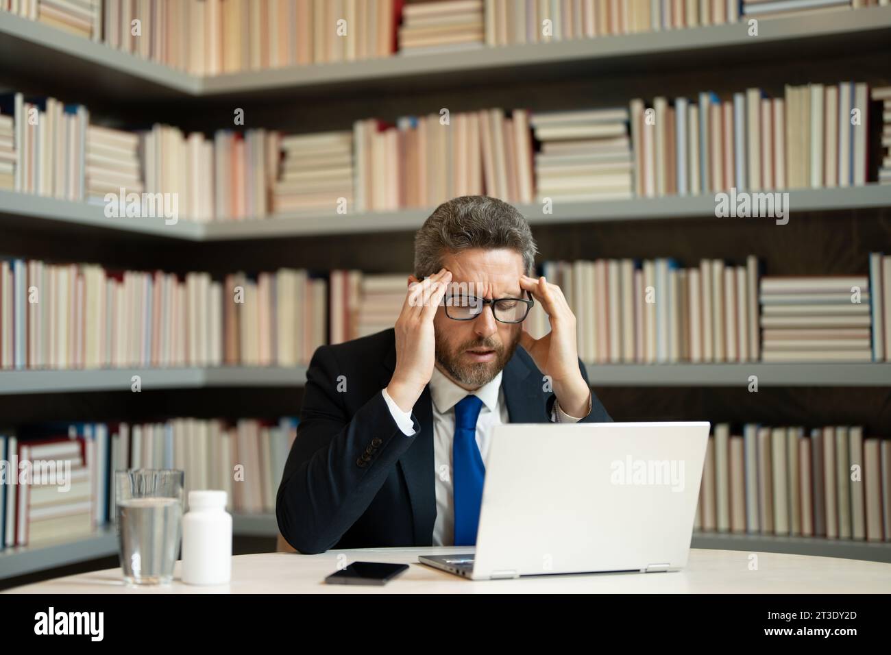 Tired, headache and eye strain on laptop. Man with stress, burnout and ...