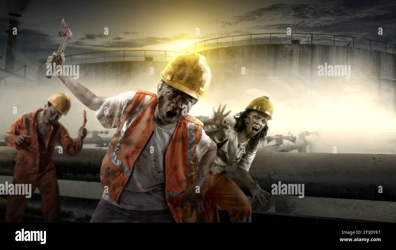 A scary construction worker zombie with blood and wounds on his body is ...