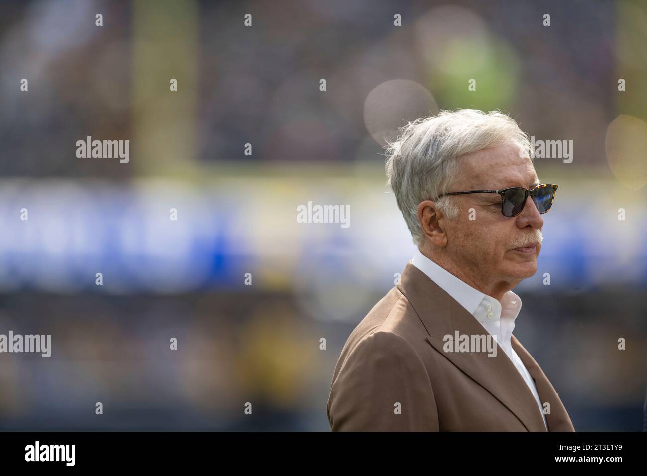 Los Angeles Rams owner Stan Kroenke watches players warm up before an ...