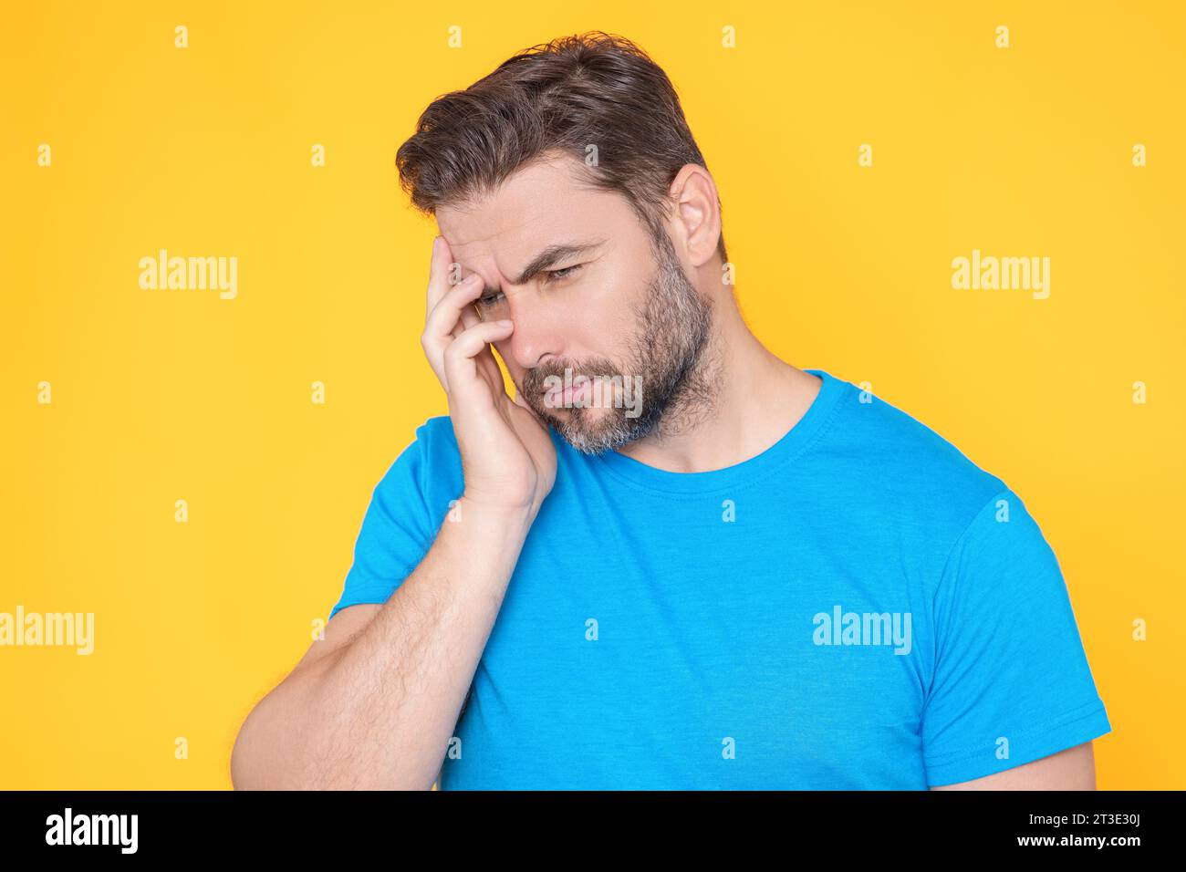 Migraine, tiredness and stress. Man in studio, is tired got headache ...