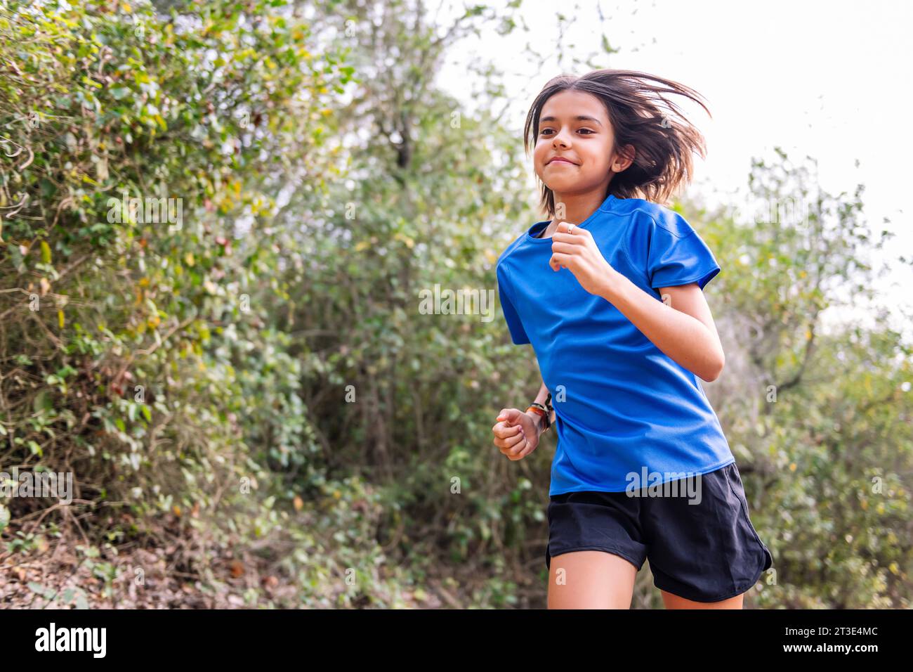 kid practicing trail running in the forest Stock Photo - Alamy