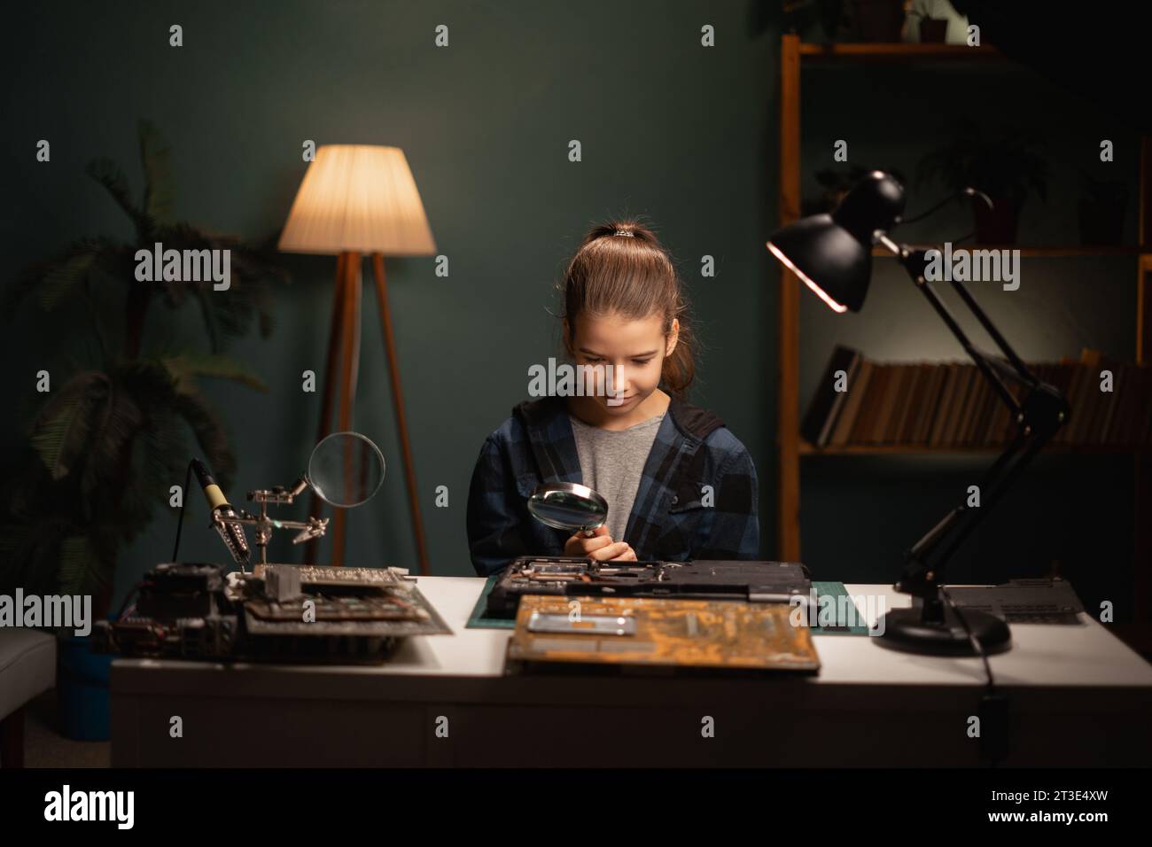 Caucasian teenage girl for searching way of fixing broken laptop. Cute ...