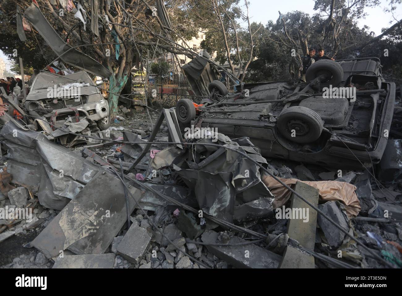 Palestinians watch destruction by the Israeli bombardment of the Gaza ...