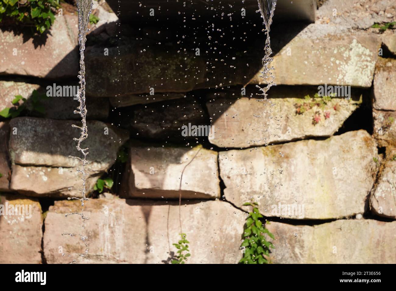 Dancing jet of water before the wall of a sunny fountain Stock Photo ...
