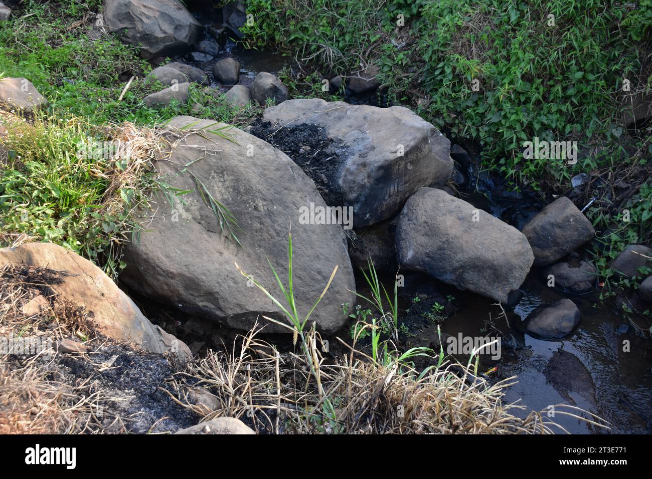 giant mountain rock in a river Stock Photo - Alamy