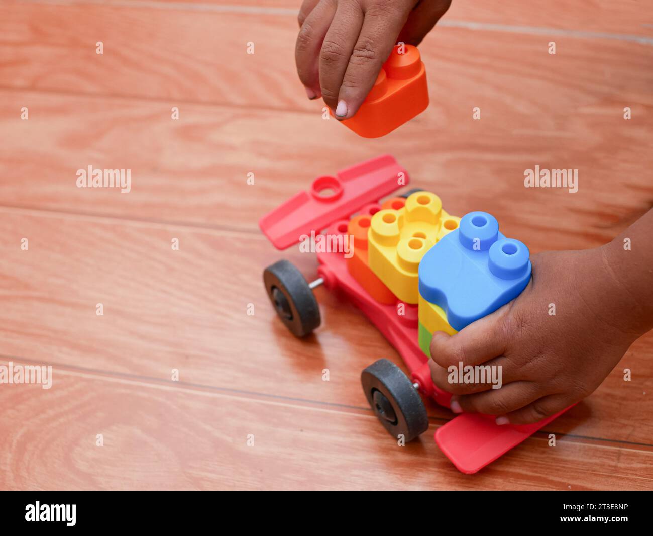 kids hand playing with a disassembled toy car Stock Photo - Alamy