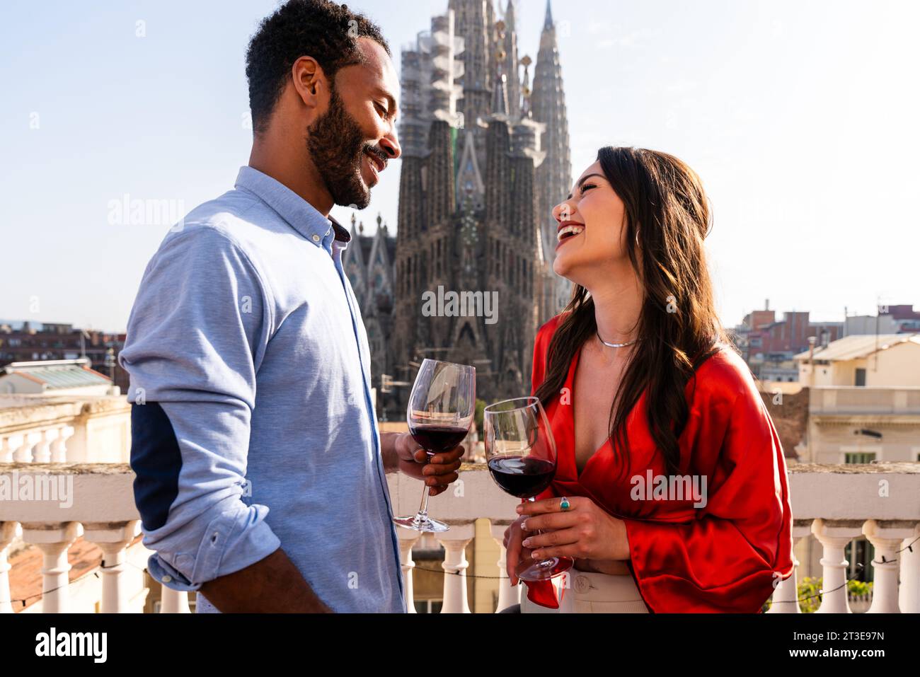 Multiracial beautiful happy couple of lovers dating on rooftop balcony ...