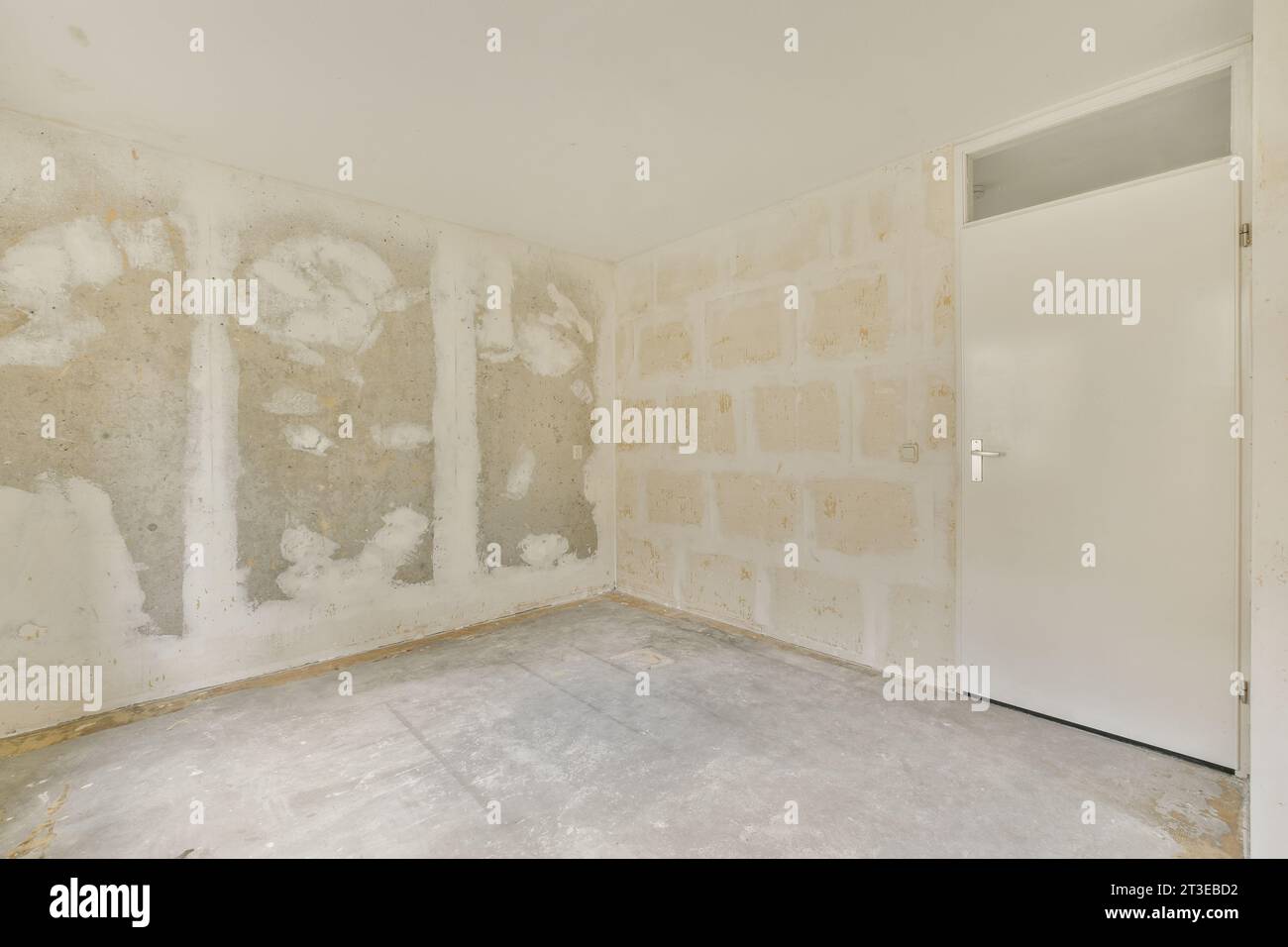 an unfinished room with white walls and dry plaster on the wall is in ...