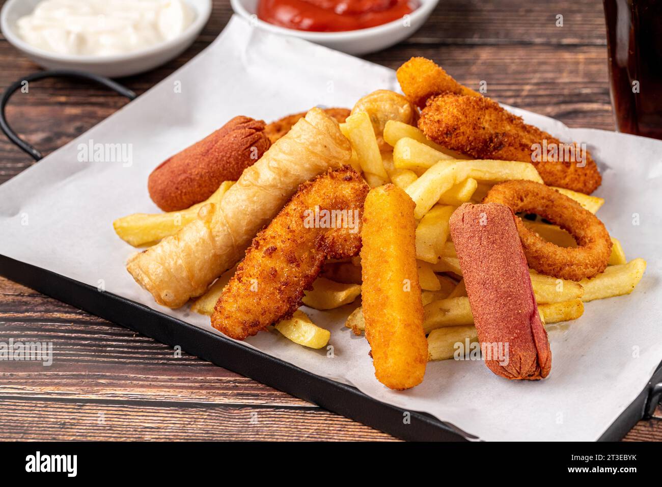 Snack plate with french fries, crispy chicken, cheese sticks, sausage ...