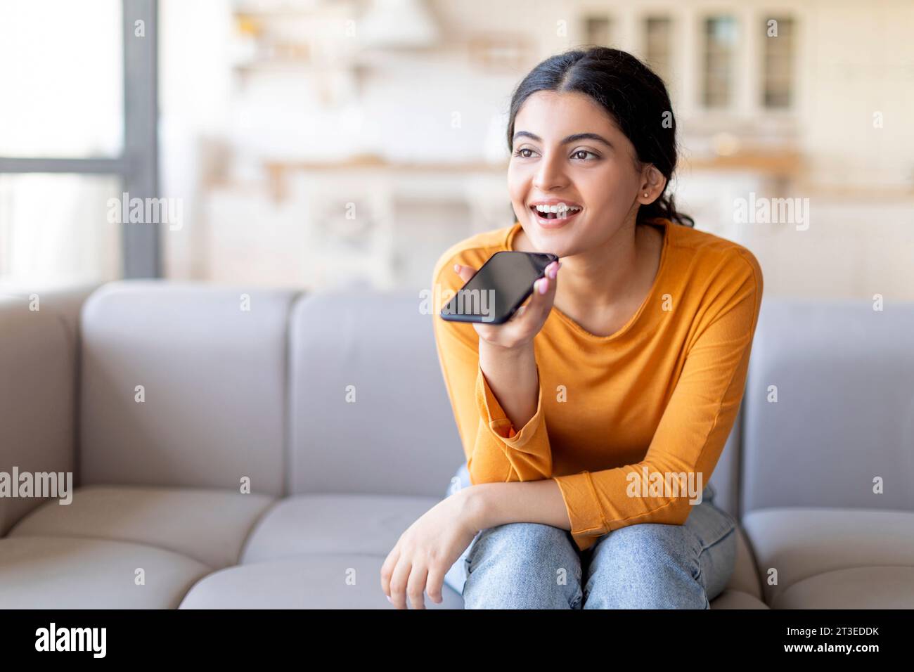 Smiling Indian Woman Recording Voice Message On Smartphone While ...