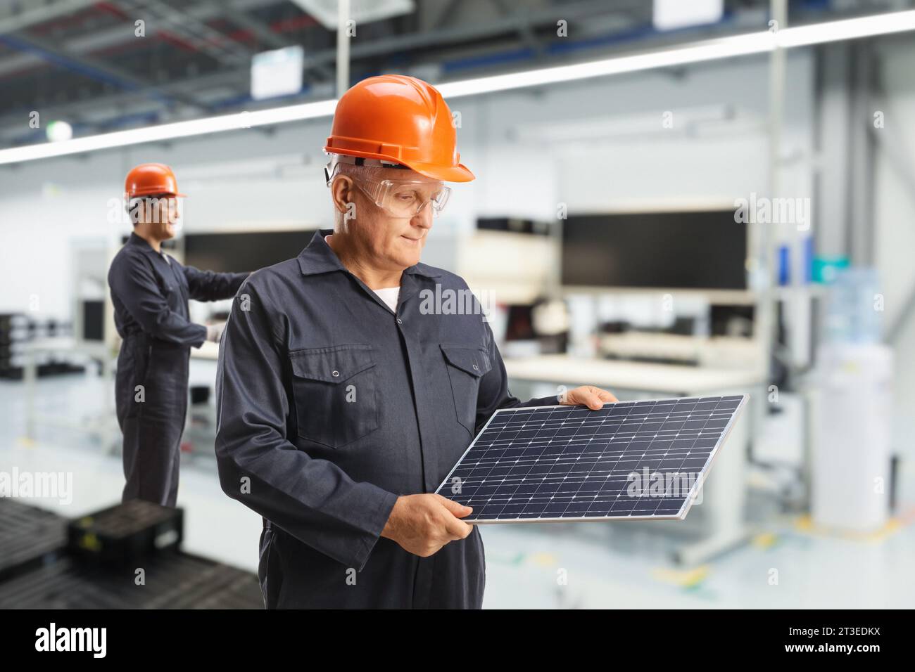 Workers inside a solar panel factory, sustainable solutions for energy ...