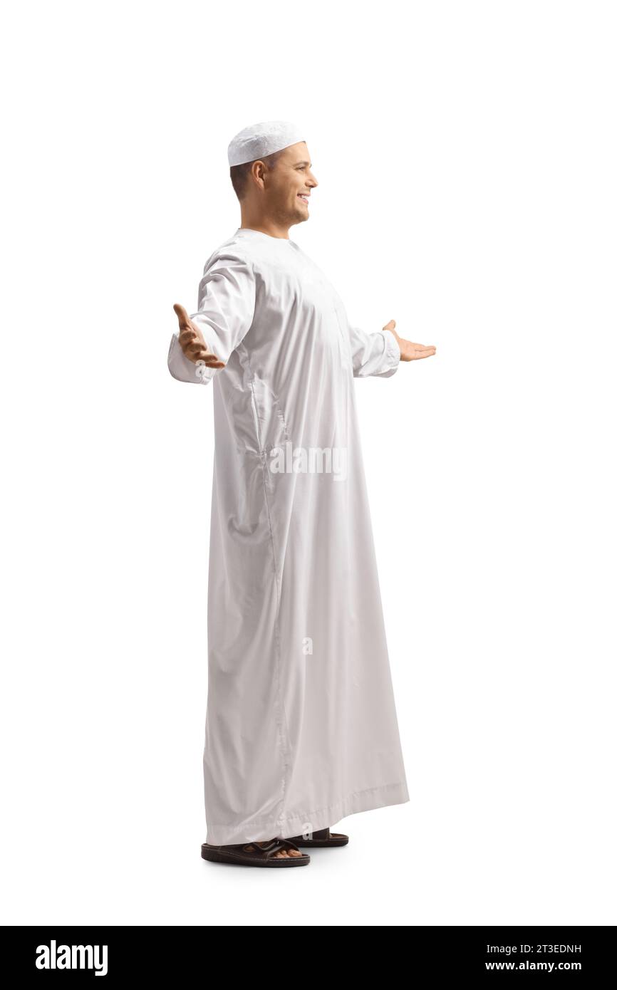 Young muslim man in ethnic clothes waiting with arms wide open isolated ...
