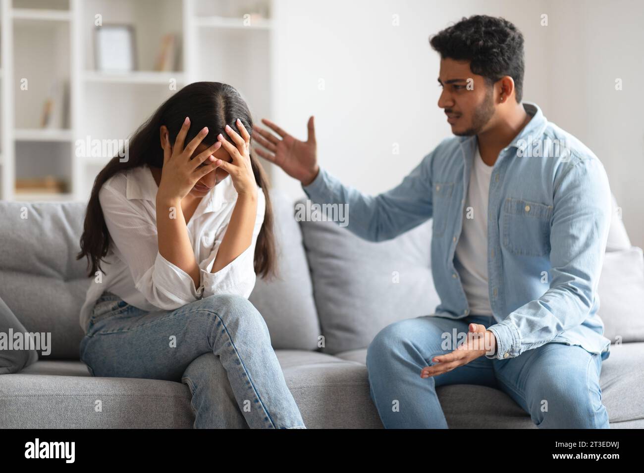 Young Indian couple in a tense discussion at home Stock Photo - Alamy