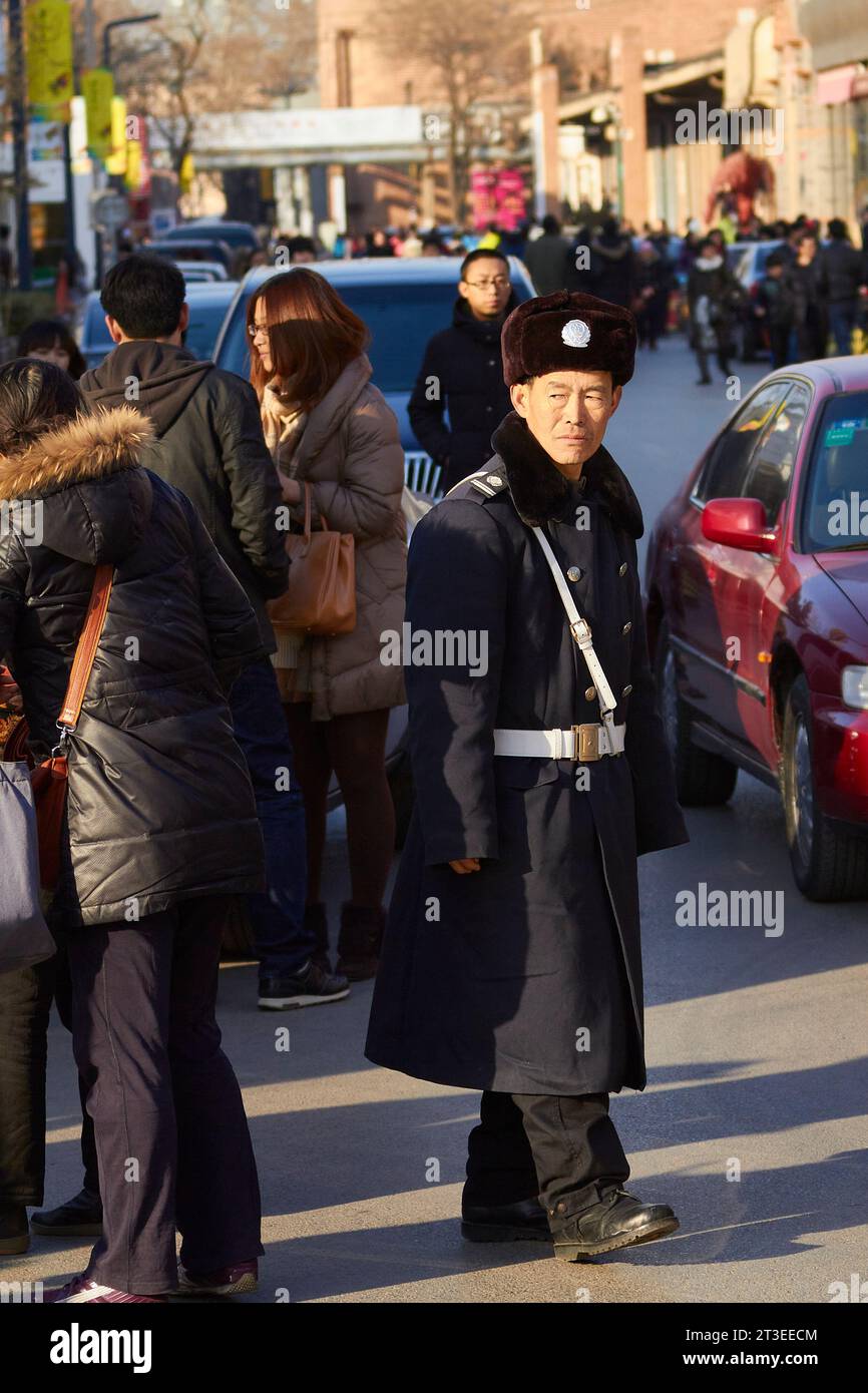 A Chinese Security Guard Directing Traffic In The 798 Art Zone ...