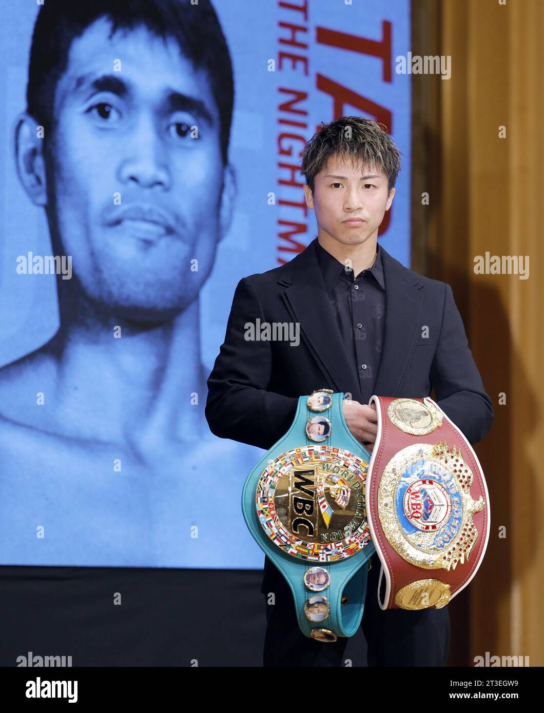 Japanese boxer Naoya Inoue poses for photos after attending a press conference in Yokohama ...
