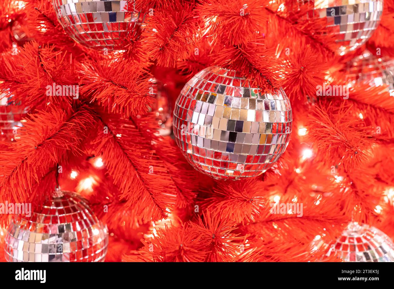 Christmas disco ball on a red Christmas tree. new Year's background ...