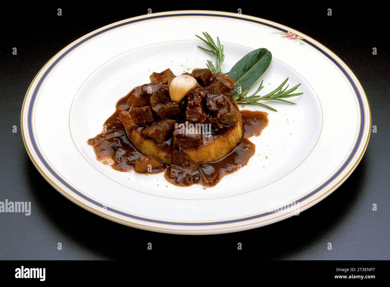 Italian food recipes. Veal cheek in Barbera red wine and polenta Stock ...