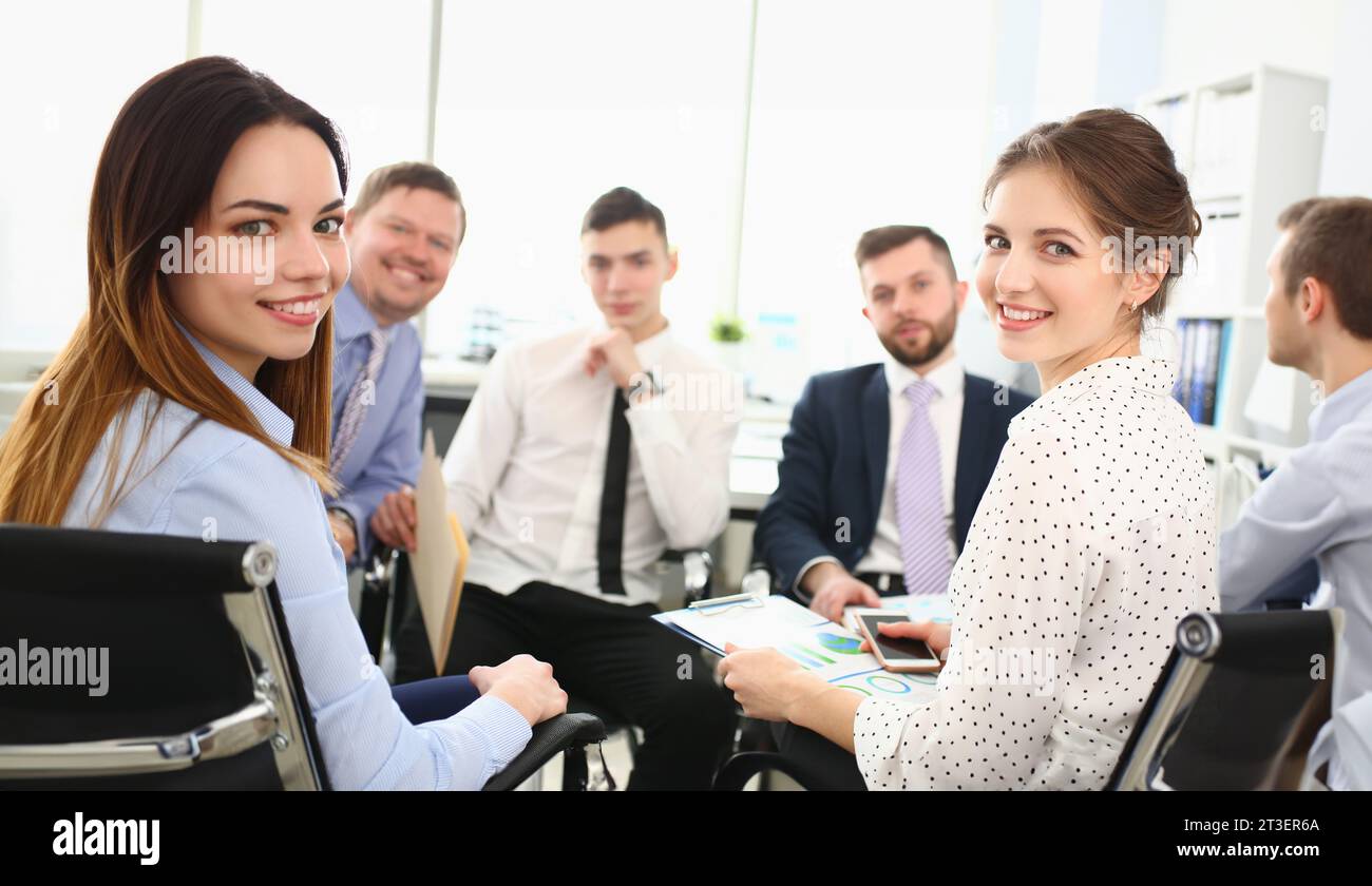 Portrait of smart colleagues discussing important biz topic that can ...