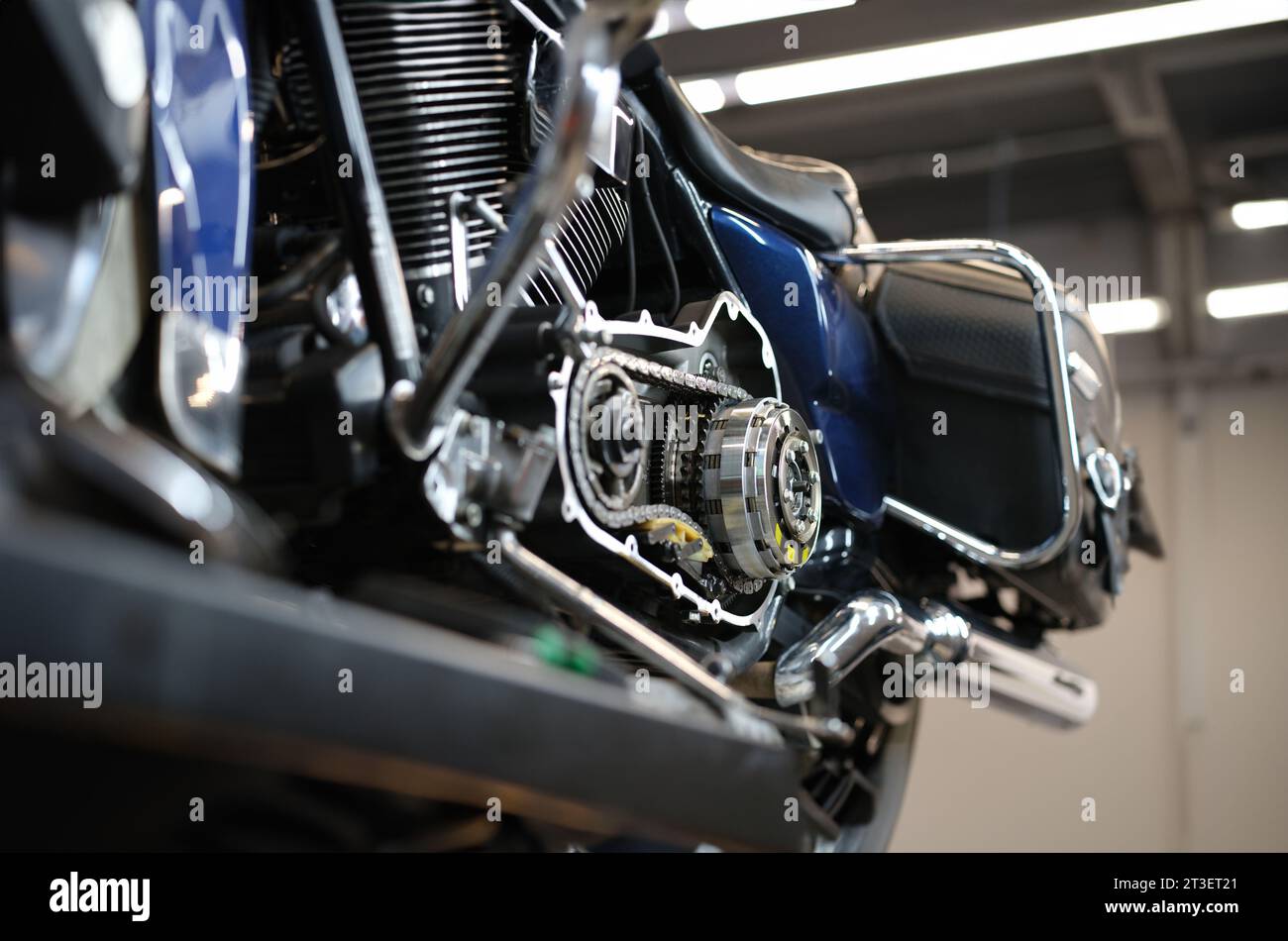 Open chromed motorcycle motor with chain on bench in garage Stock Photo ...