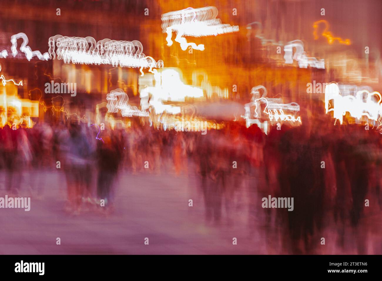 Moving blurred silhouettes people in evening city landscape, with ...