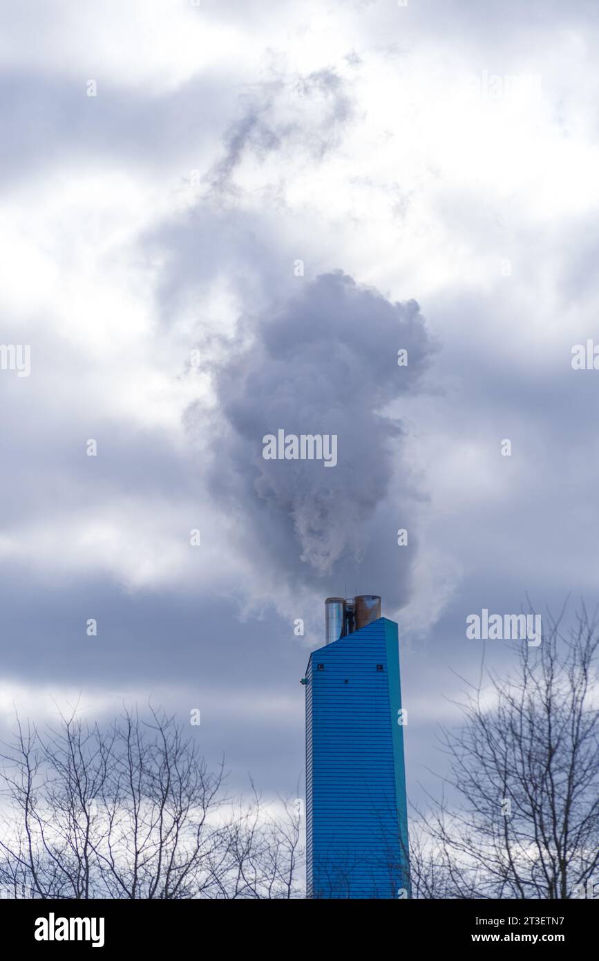 smoking chimney of a waste treatment plant Stock Photo - Alamy