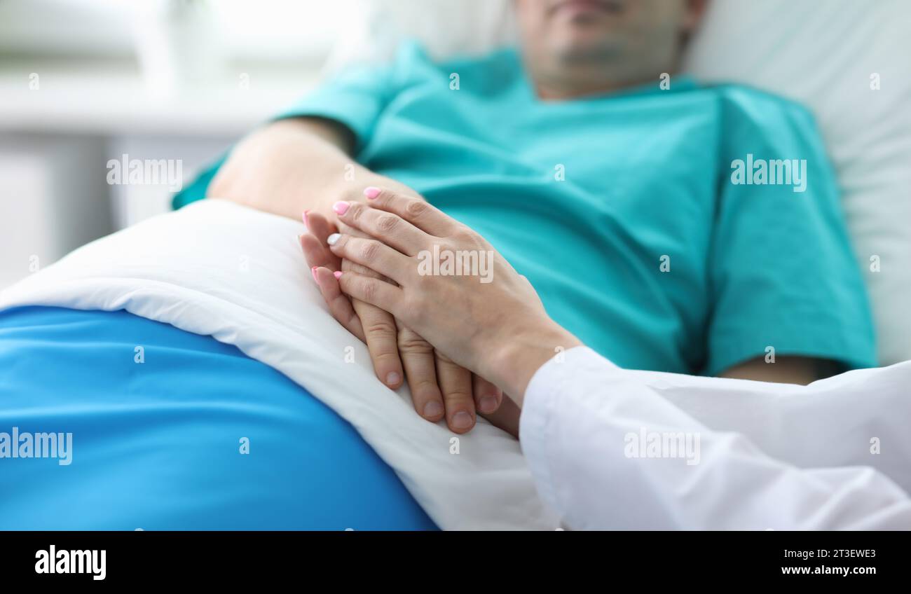 Intensive care hand doctor patient hold hi-res stock photography and ...