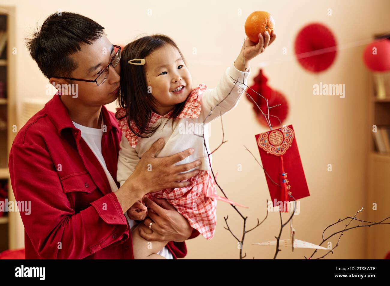 Chinese man hug daughter hi-res stock photography and images - Alamy