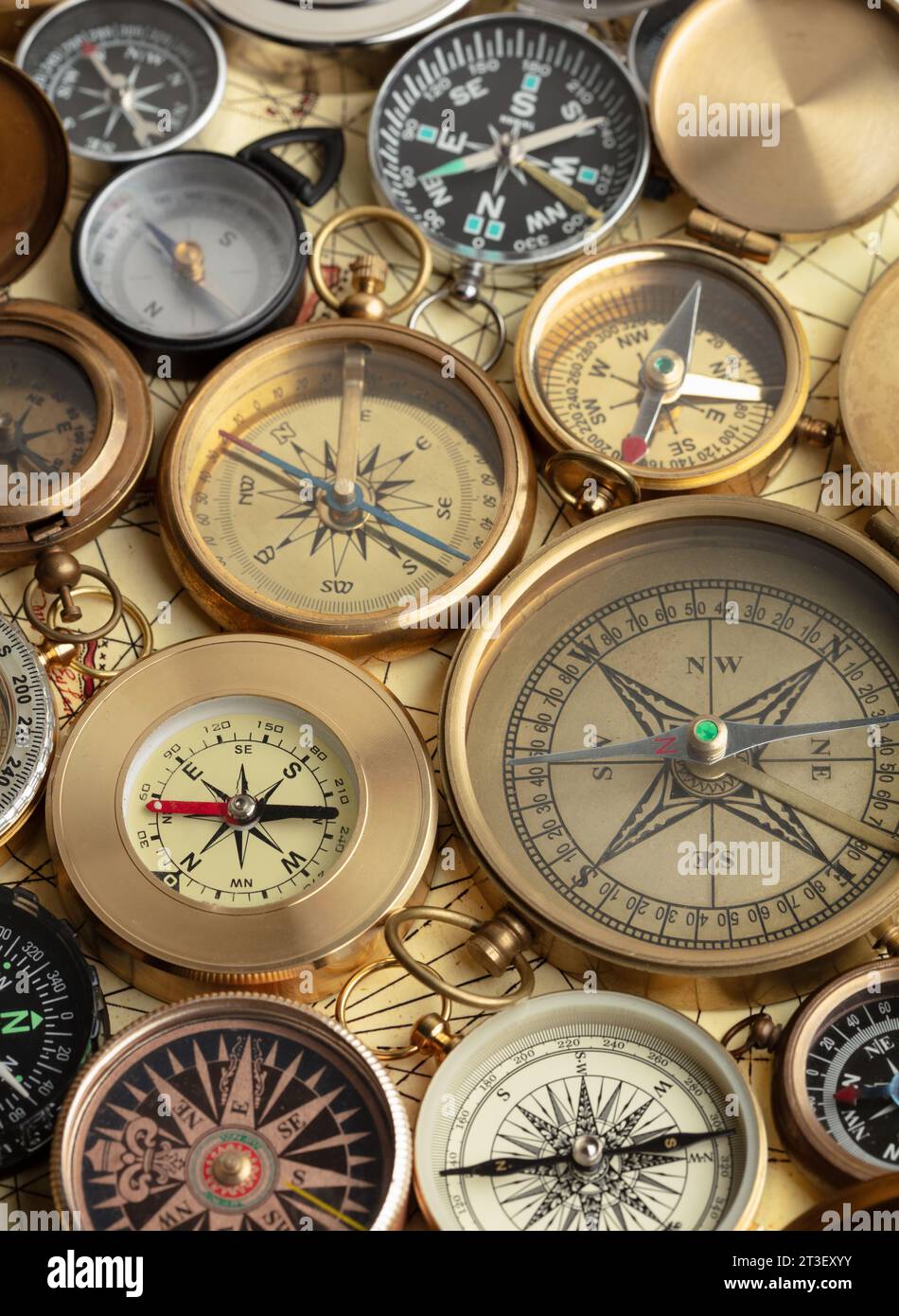 Many different compasses on an old map Stock Photo - Alamy